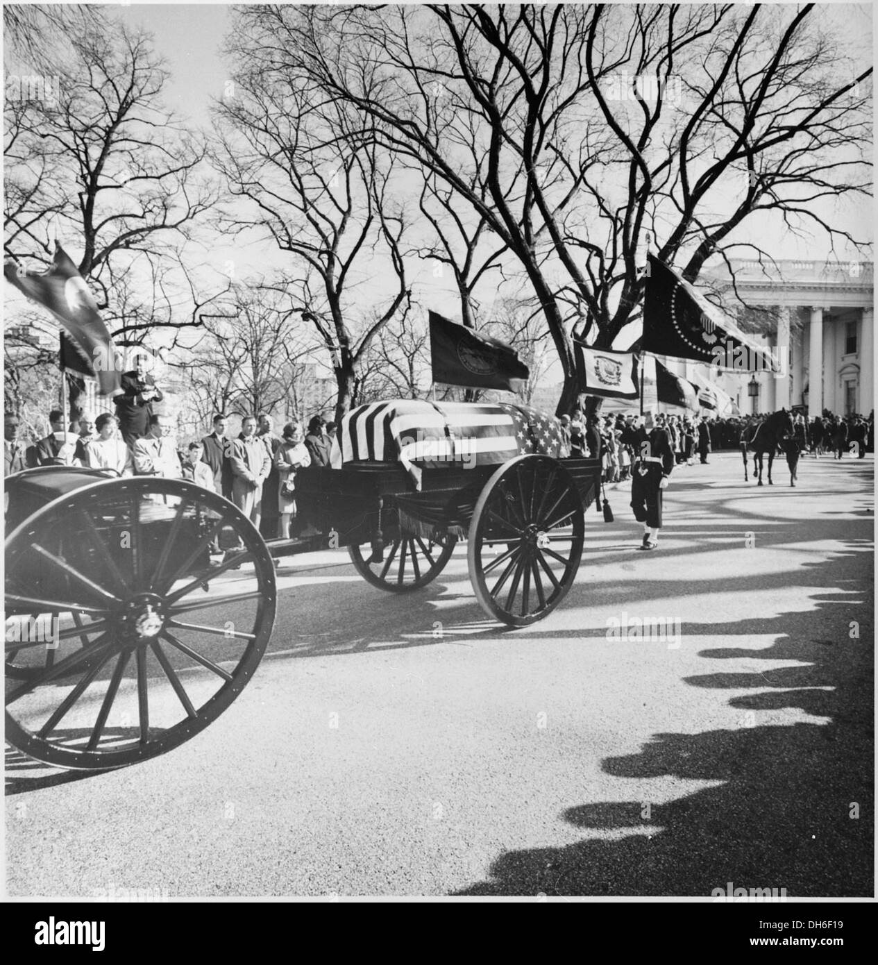 This photograph shows the caisson carrying the flag-draped casket of ...