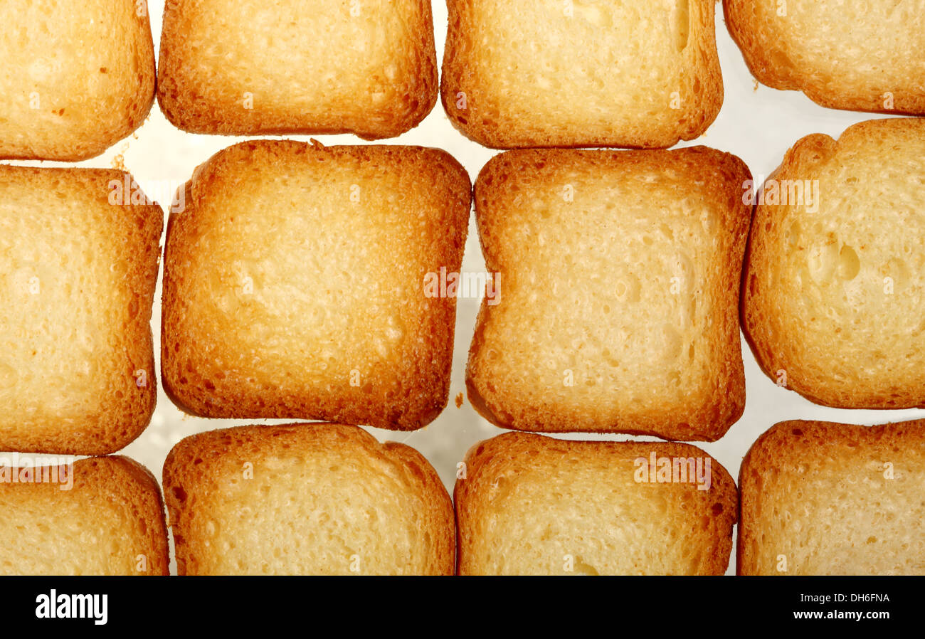 Many small dried rusks bread loaf toast biscuits as texture background ...