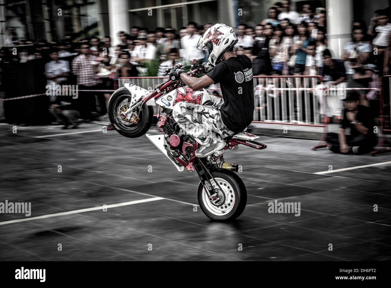 Stunt riding exhibition at the annual Bangkok motorcycle show. Thailand ...