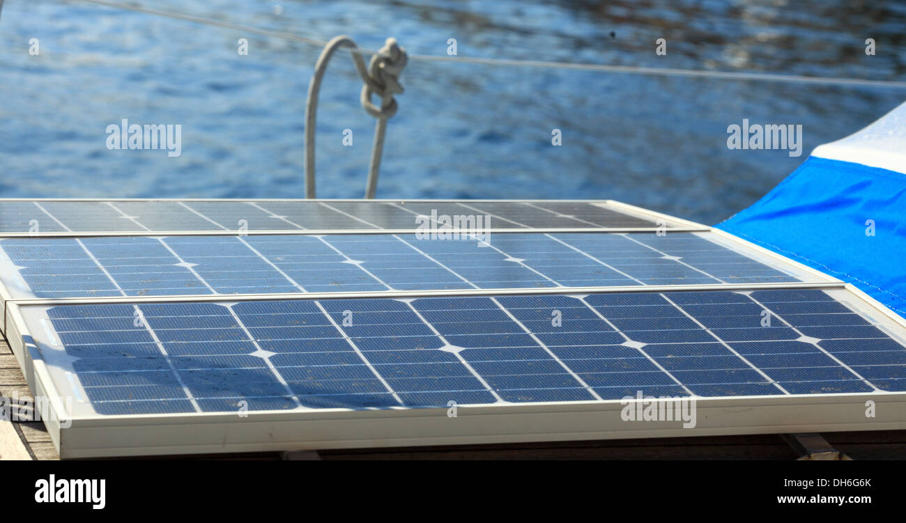 Solar charging batteries aboard a sail boat. Photovoltaic panels ...
