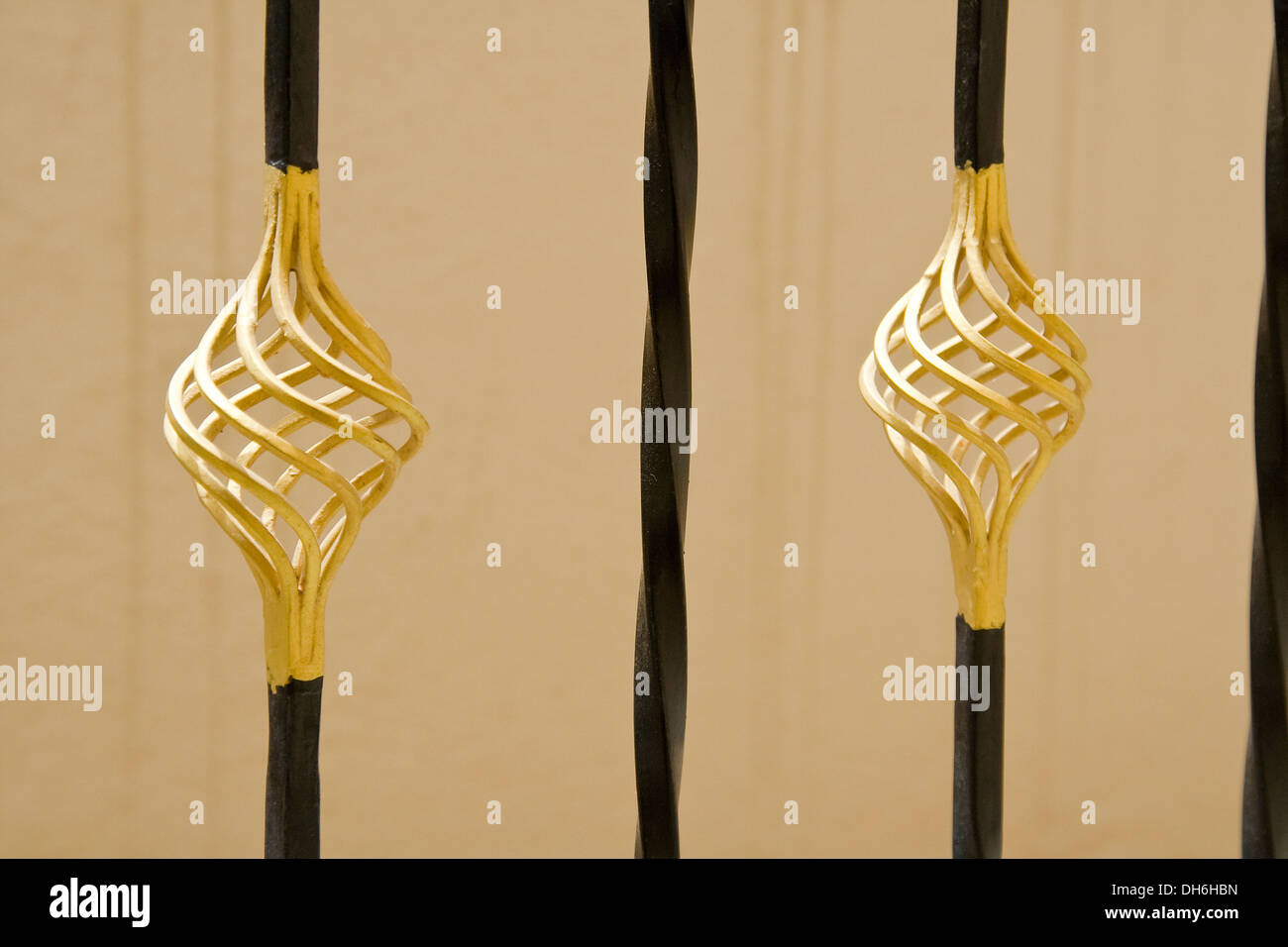 Bulbous design of gold-painted iron barricade rods Stock Photo - Alamy