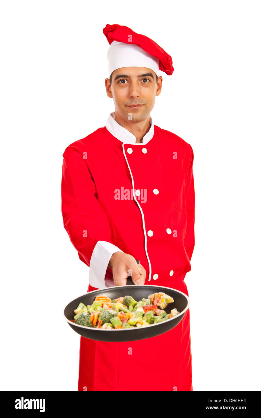 Chef showing vegetables in frying pan isolated on white background ...