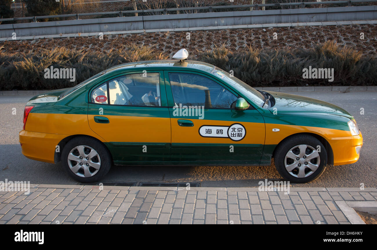 Beijing Taxi driving on the road Stock Photo - Alamy