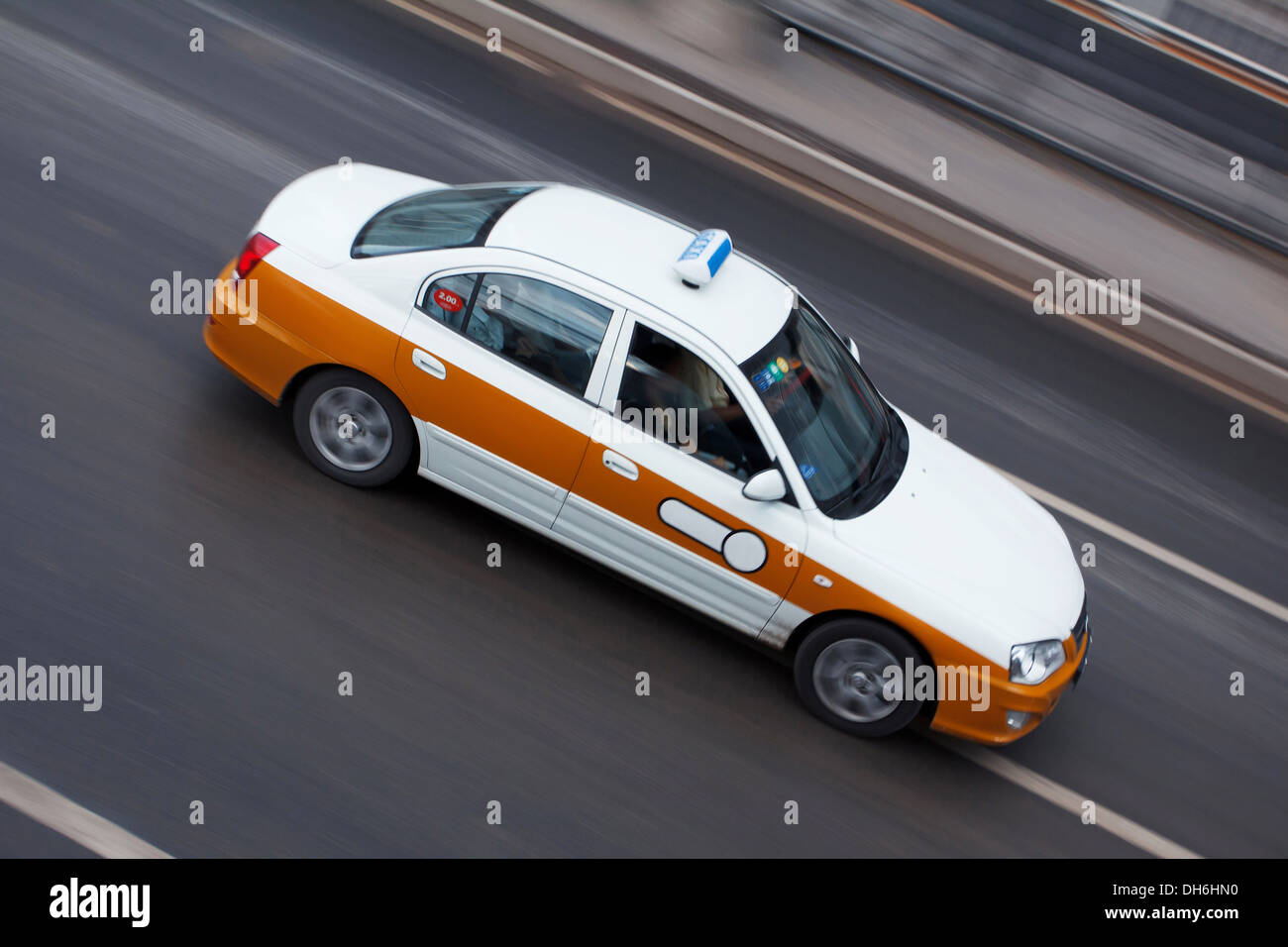 Beijing Taxi driving on the road Stock Photo - Alamy