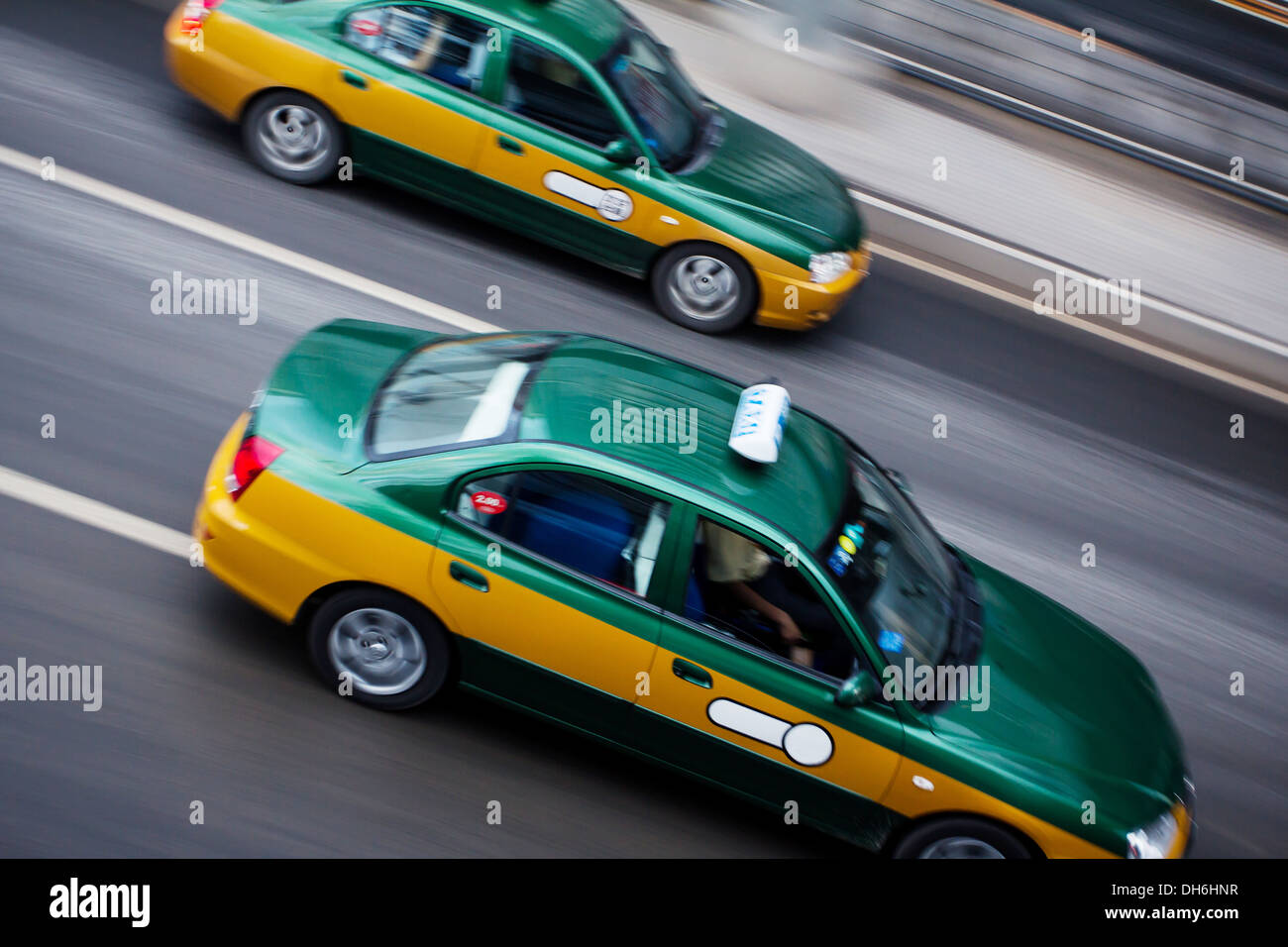 Beijing Taxi driving on the road Stock Photo - Alamy