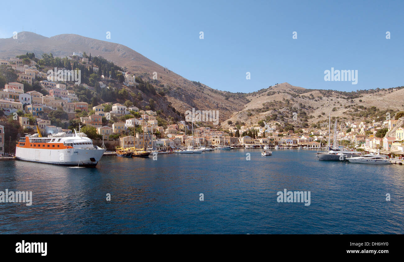 Boats at the pier. island Symi, Greece Stock Photo - Alamy