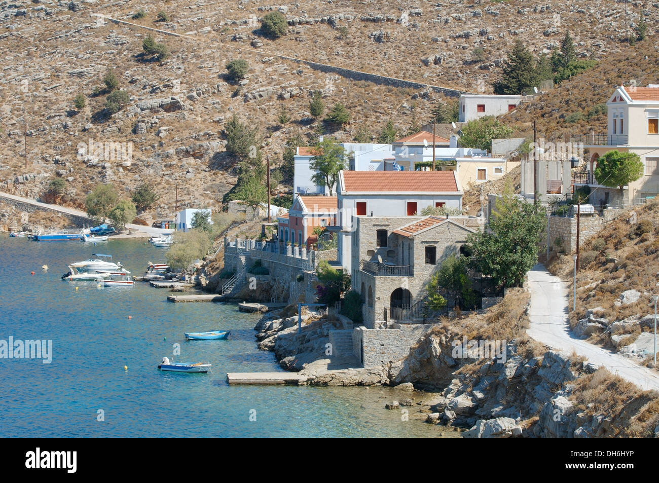 Boats at the pier. island Symi, Greece Stock Photo - Alamy