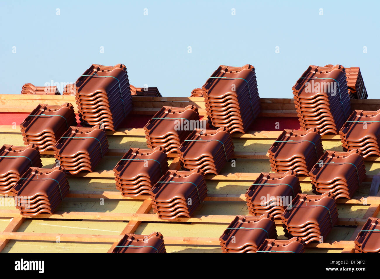 Renovation of a house roof with stacks of roof tiles Stock Photo - Alamy