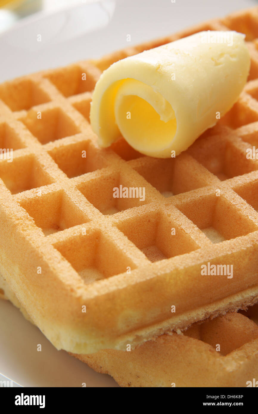 Close up of a stack of waffles with butter Stock Photo - Alamy
