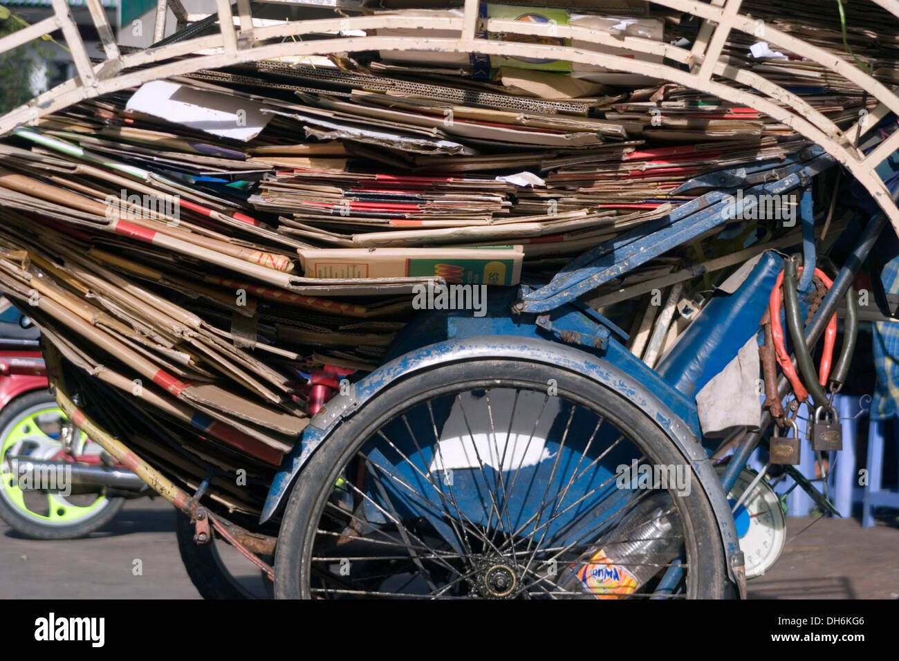 A homemade cart used by a man to collect recyclable cardboard material ...