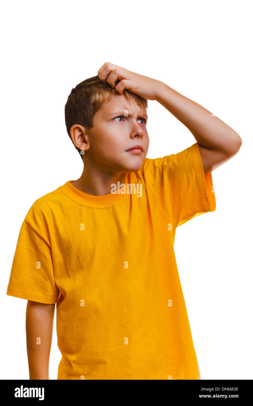 teen kid boy blonde in yellow shirt scratching his head looking up ...