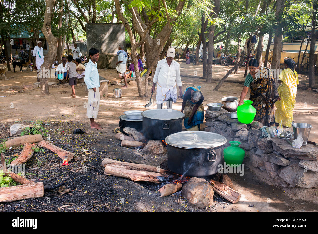 Indian people cooking school meals on open fires at a rural indian ...