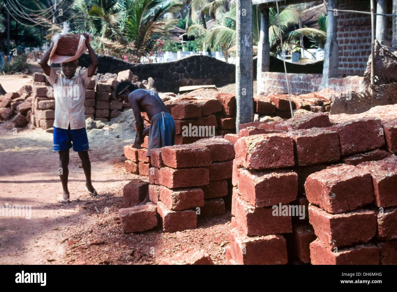 local men employed at brick making works goa india Stock Photo - Alamy
