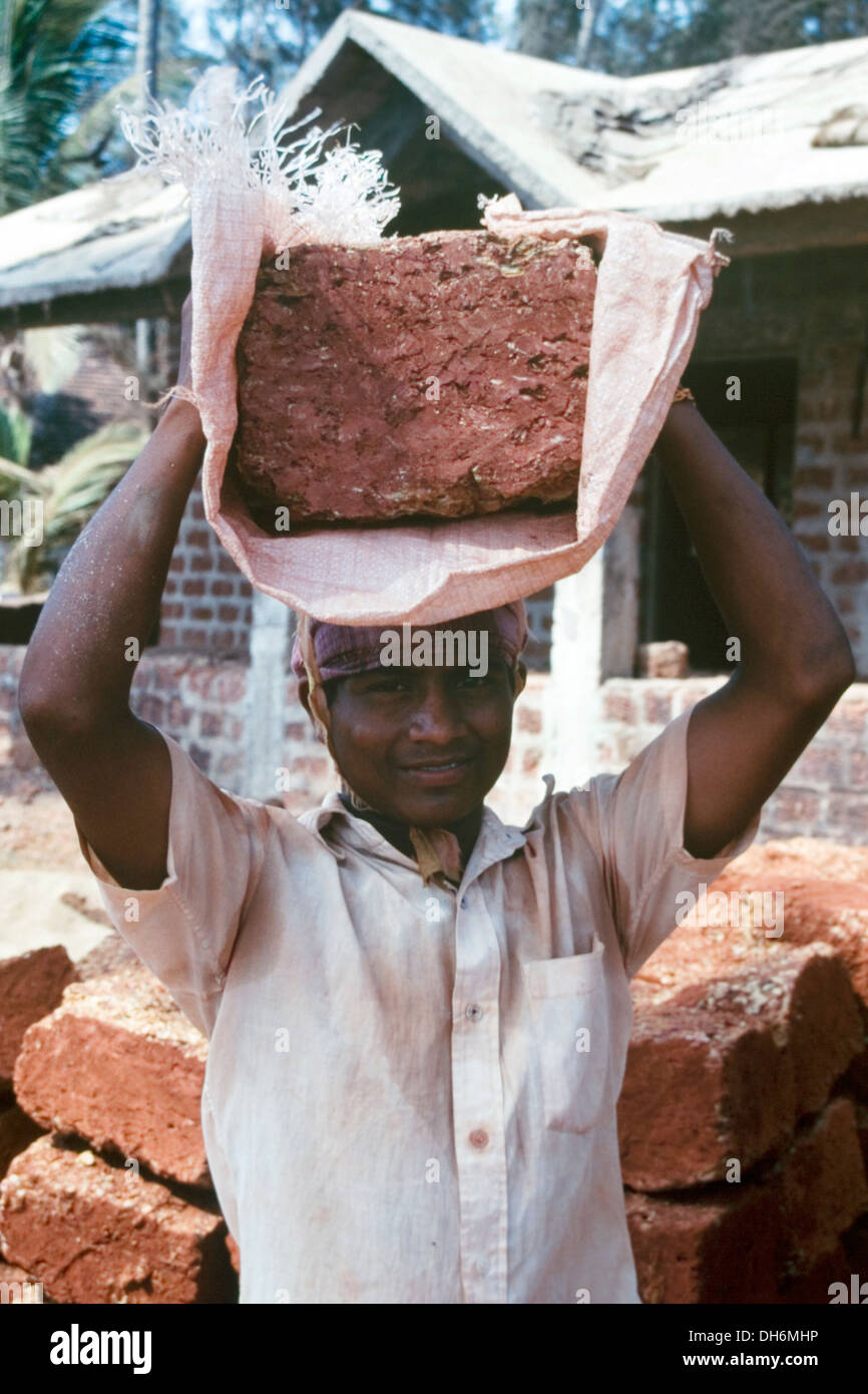 Man carrying bricks hi-res stock photography and images - Alamy