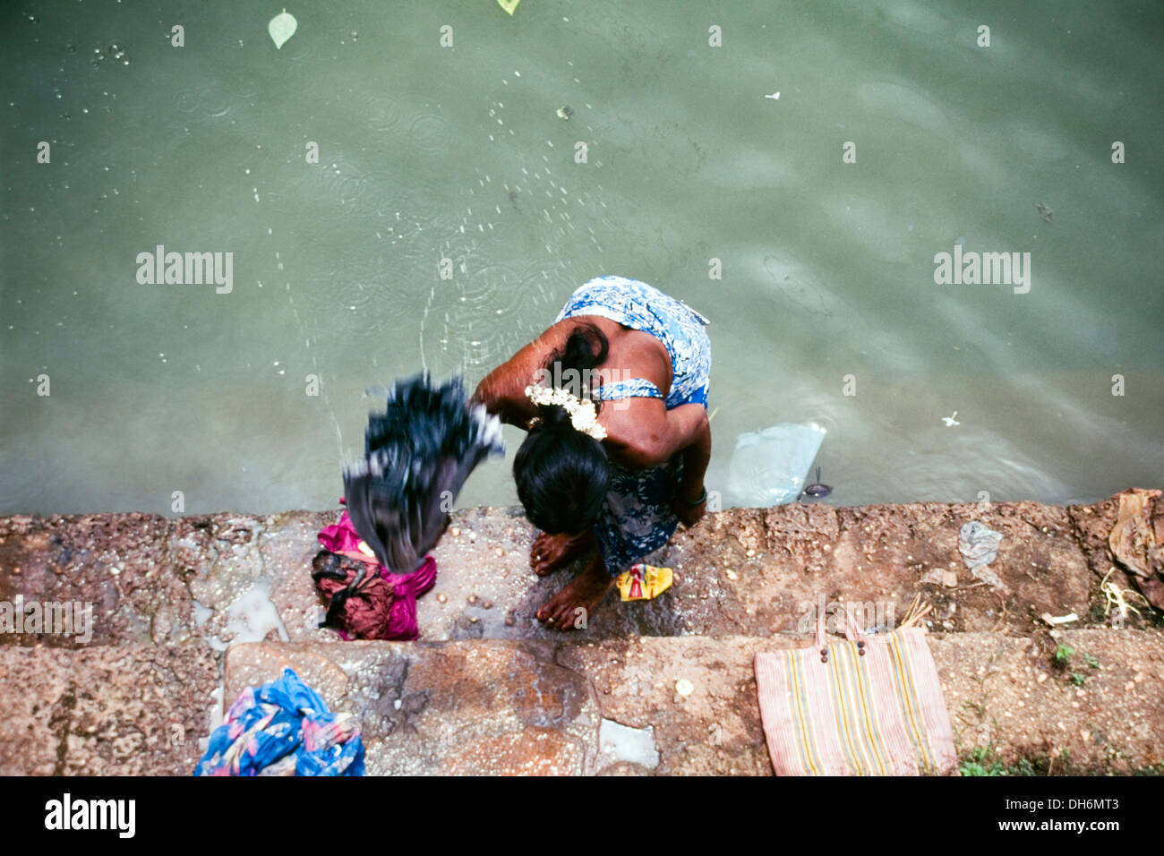 local woman doing the laundry outside in public india Stock Photo - Alamy