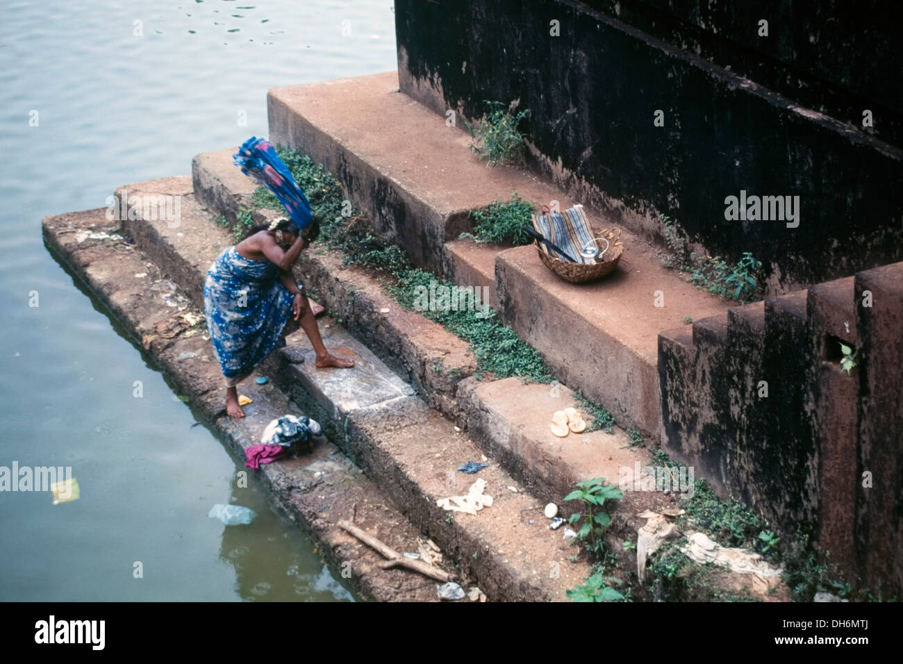 local woman doing the laundry outside in public india Stock Photo - Alamy