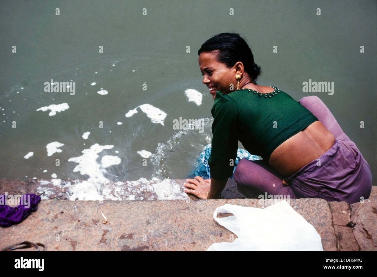 local woman doing the laundry outside in public india Stock Photo - Alamy