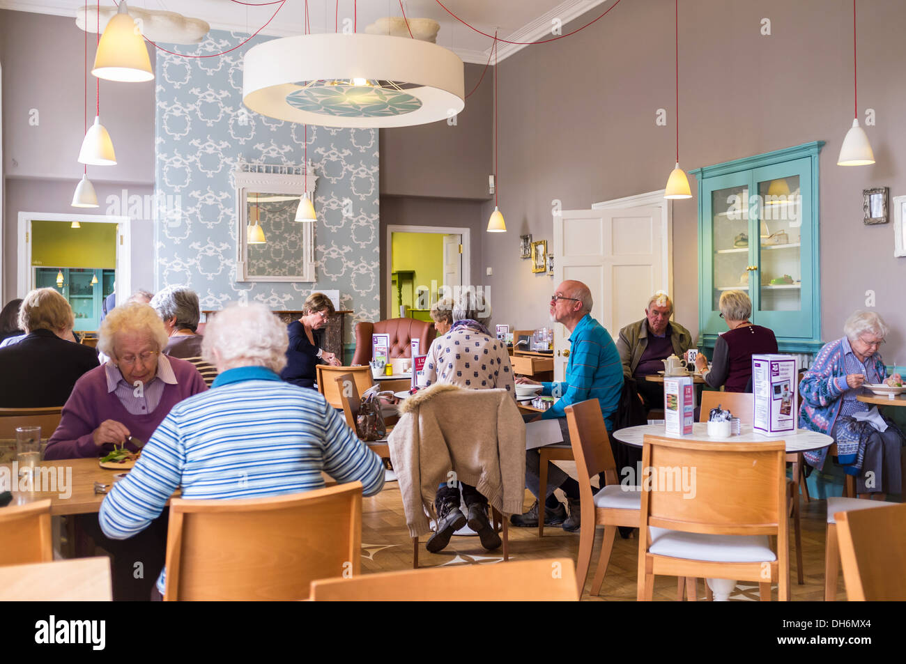 Devon, England. Senior citizens eating their lunch in a cafe in the ...