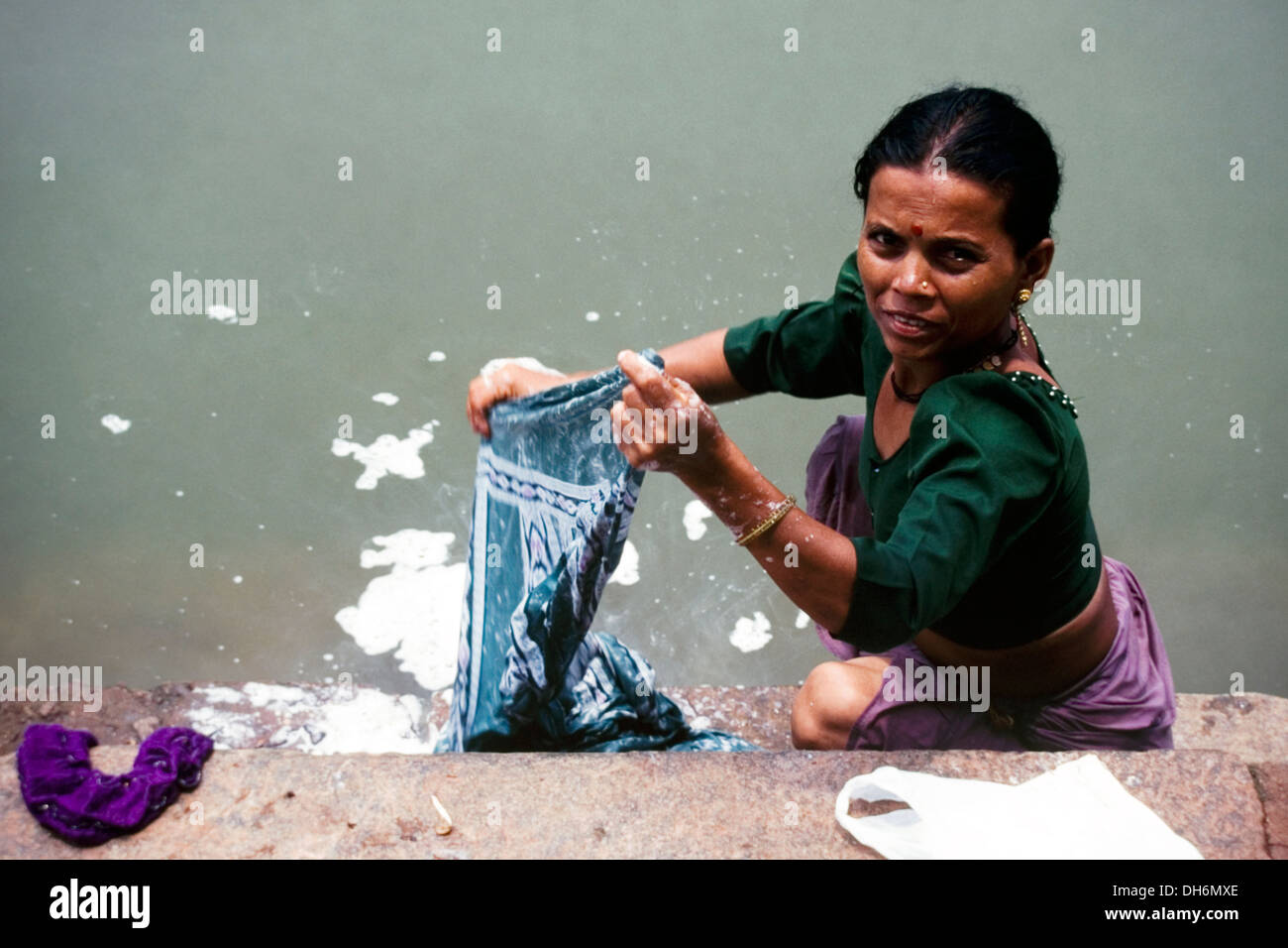 local woman doing the laundry outside in public india Stock Photo - Alamy