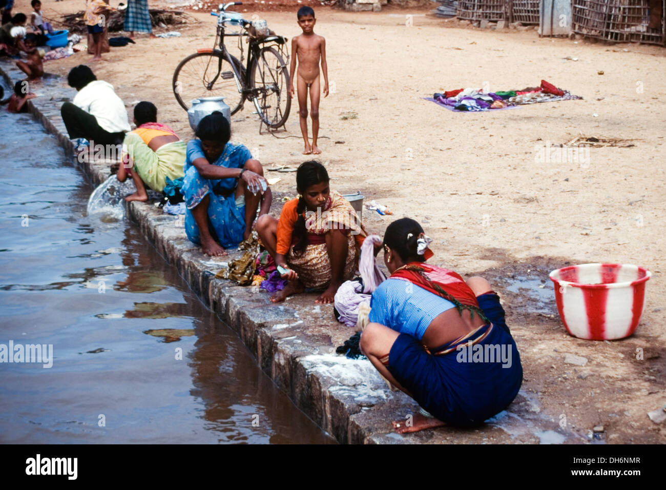 local woman doing the laundry outside in public hospet karnataka india ...