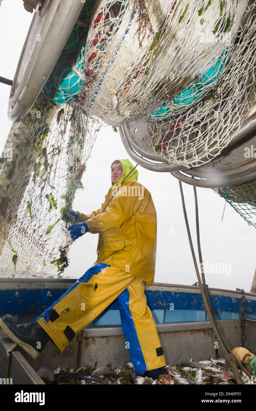 Fisherman overseeing the deployment of a trawl Stock Photo - Alamy
