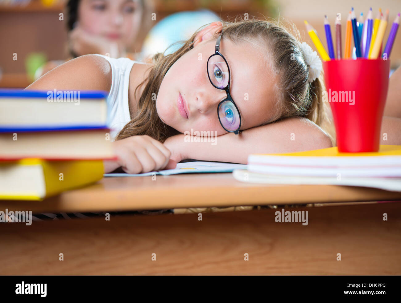 Cute girl studying in classroom at school Stock Photo - Alamy