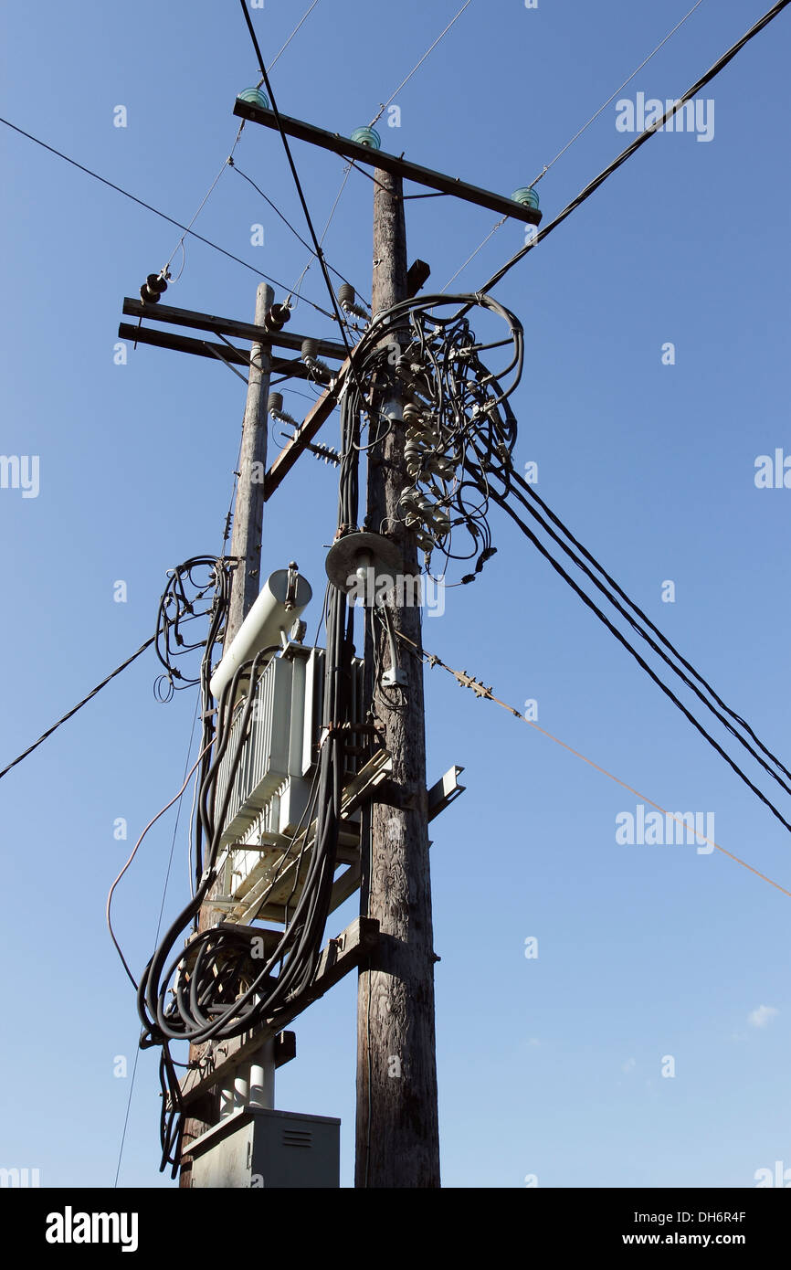 Electrical wiring and sub-station supported on two telegraph poles on ...