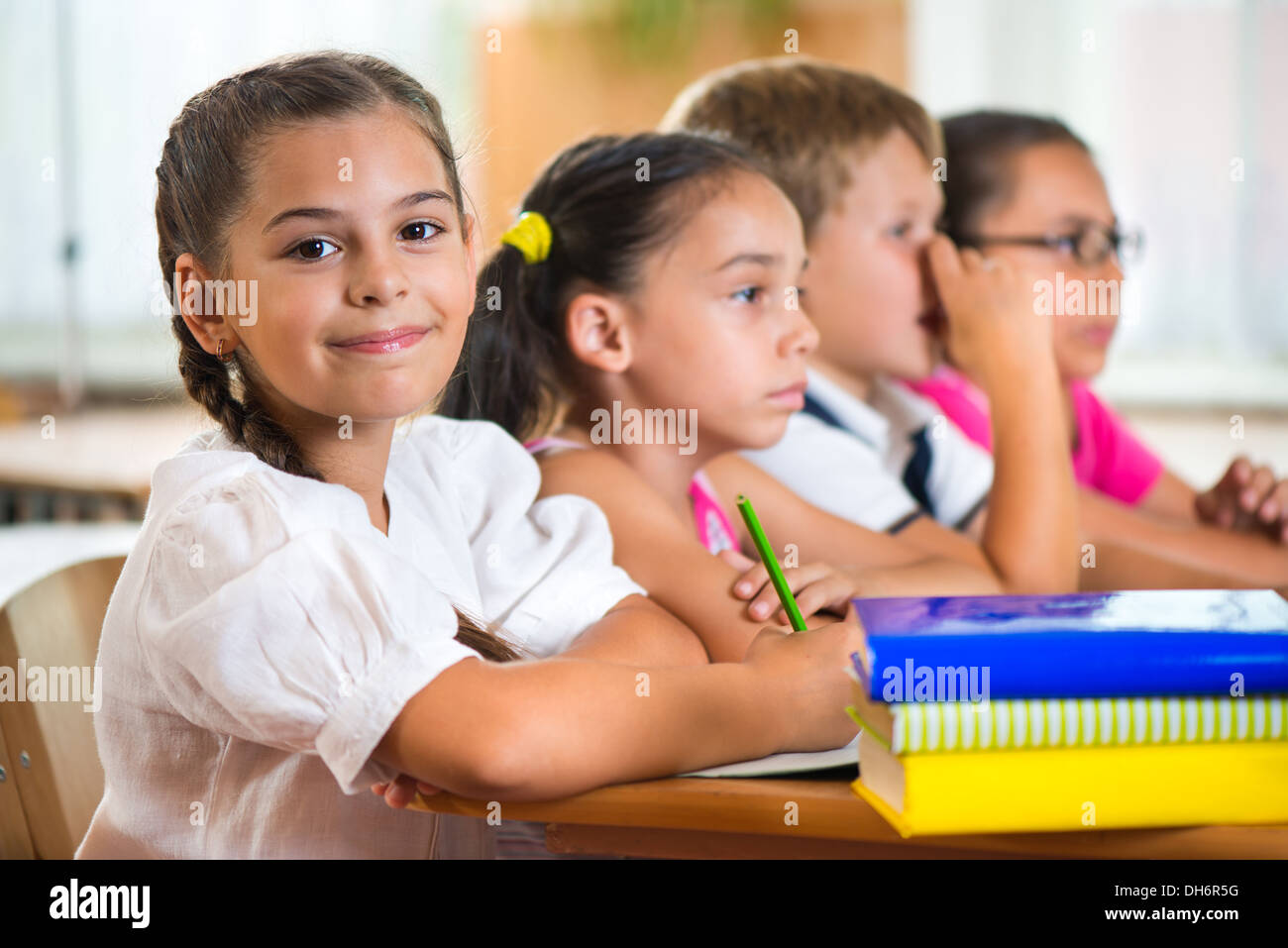 Row of happy primary school children hi-res stock photography and ...