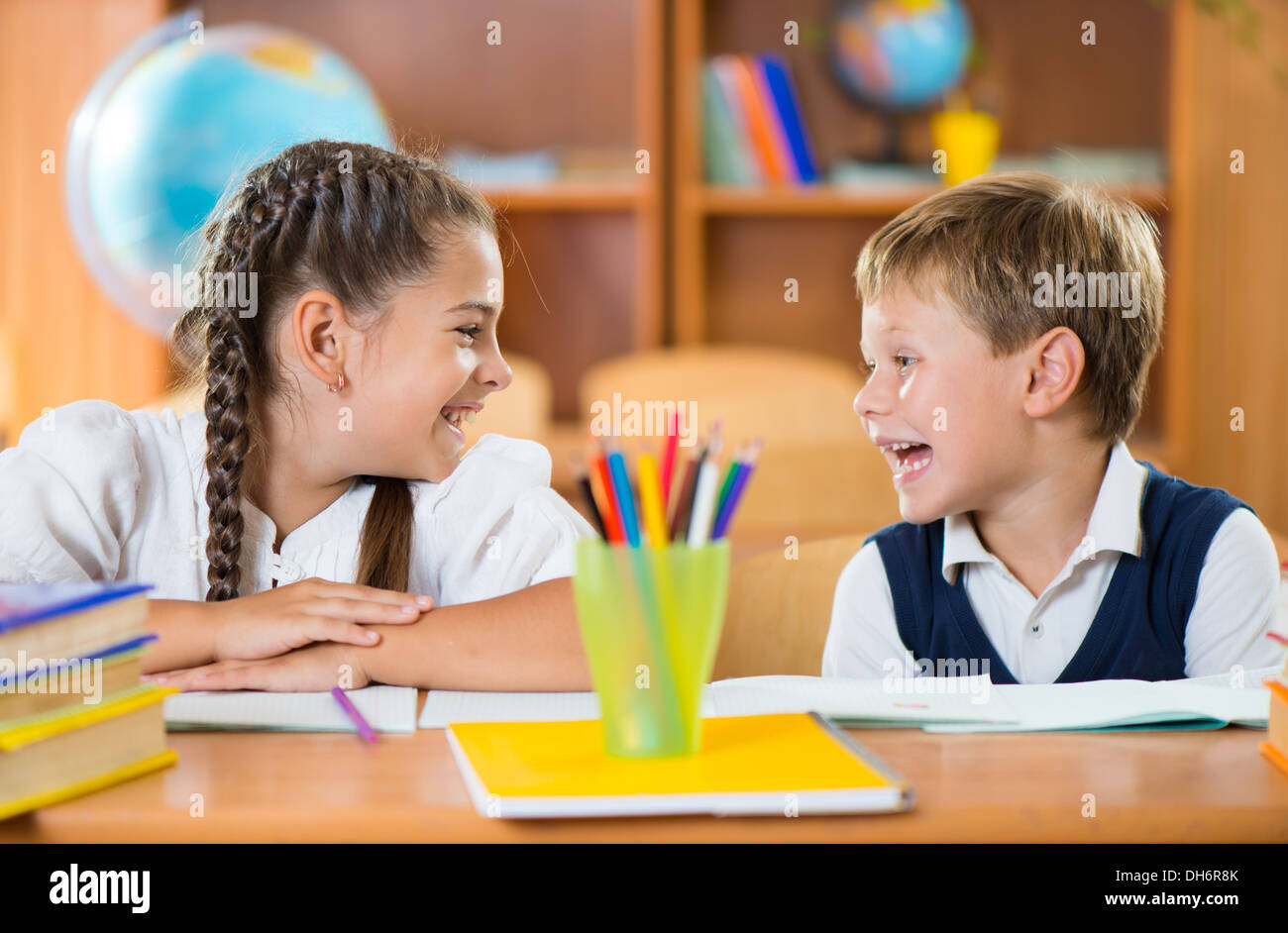 Cute schoolchildren having fun in classroom at school Stock Photo - Alamy