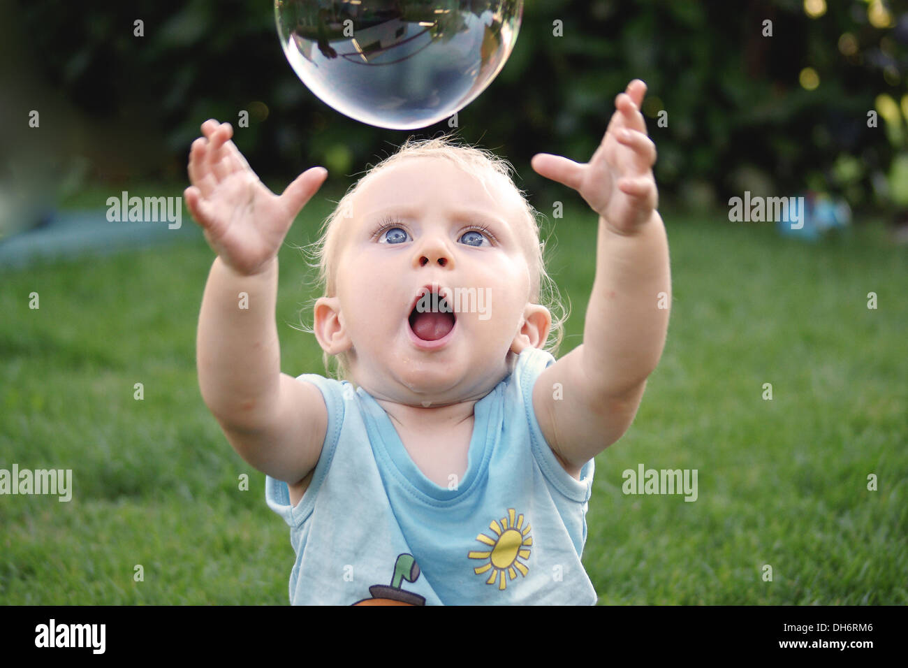 Baby with a bubble Stock Photo - Alamy