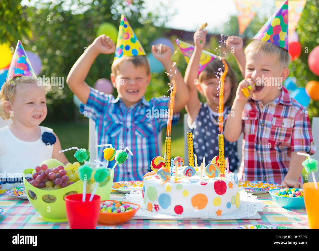 Group of adorable kids having fun at birthday party Stock Photo - Alamy
