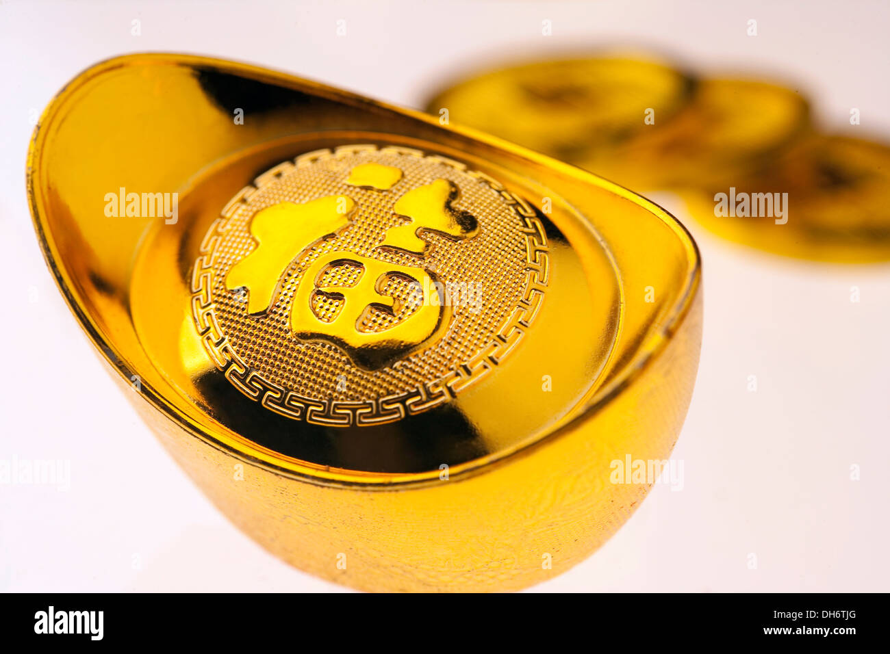 Gold ingots and copper coins Stock Photo - Alamy