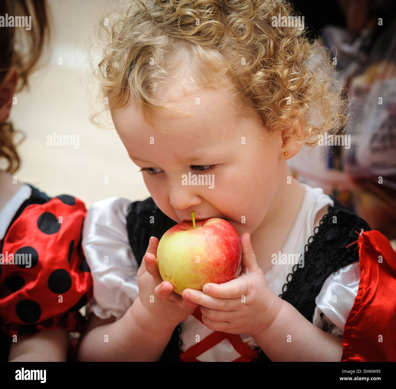 Young girl dooking for apples at a Halloween party Stock Photo - Alamy