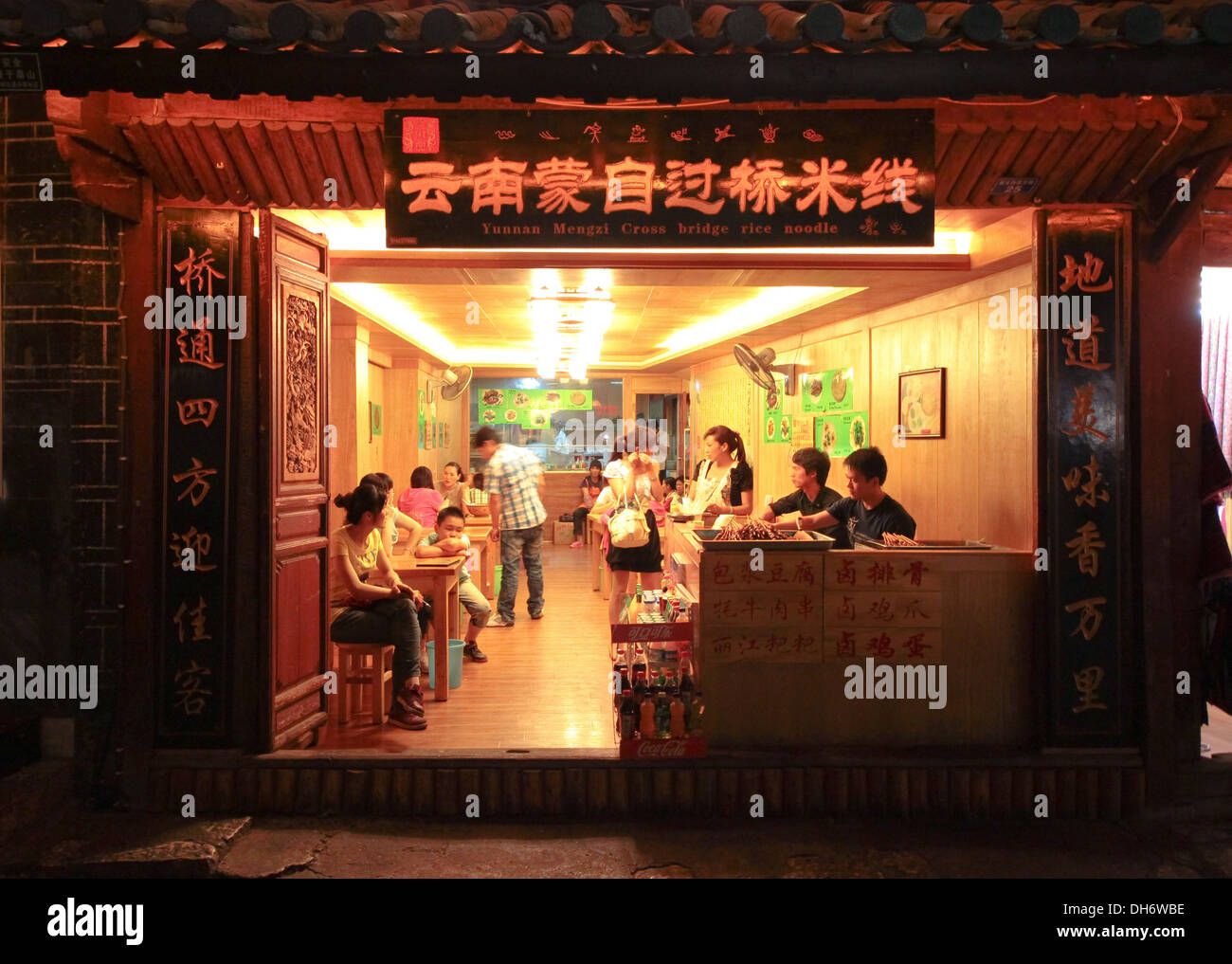 A night shop selling yunnan famous noodle "Cross Bridge Rice Noodle" at ...