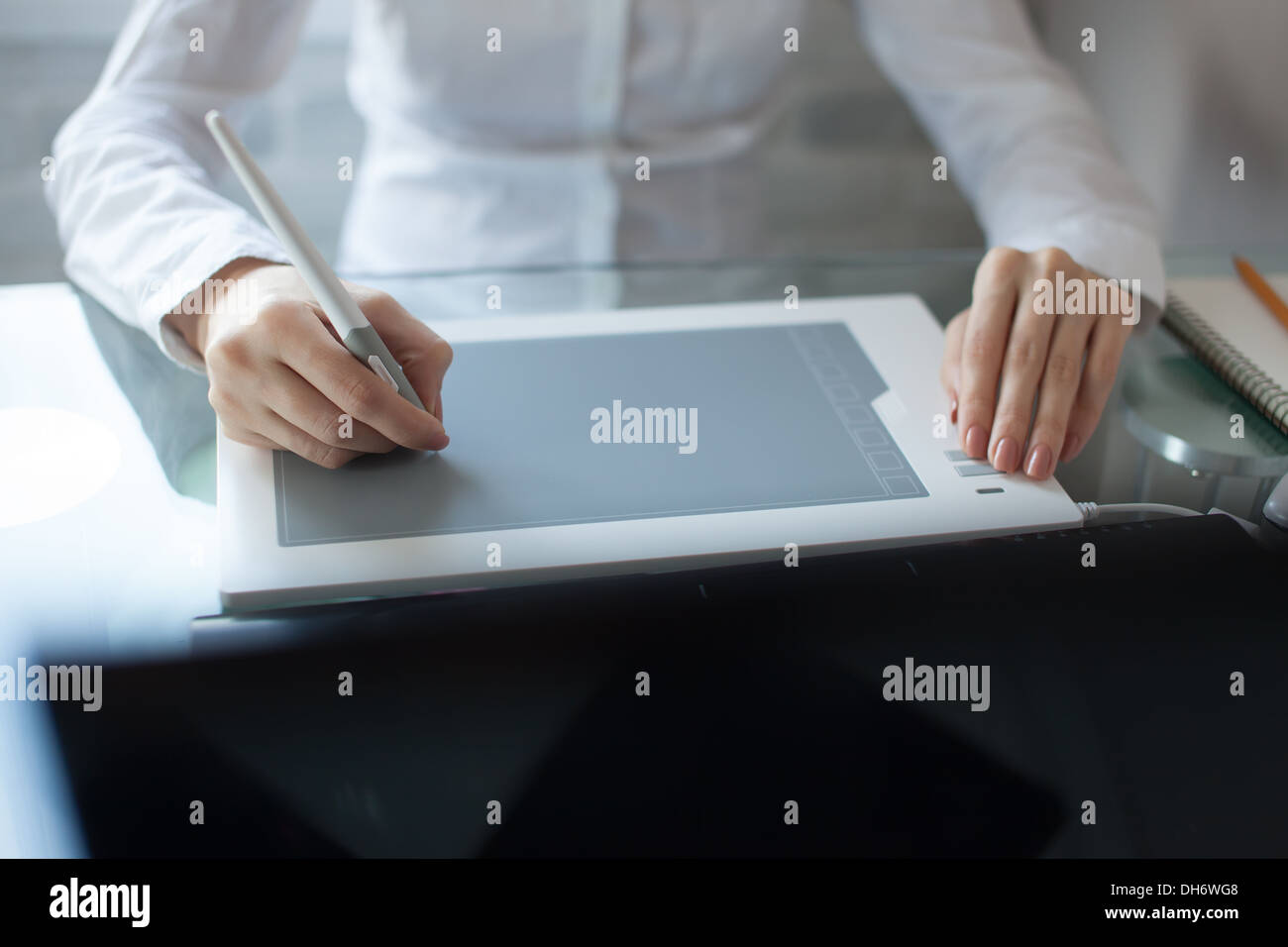 Female designer using graphics pad in office Stock Photo - Alamy