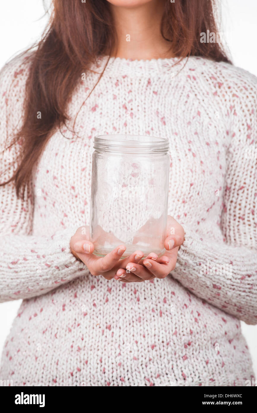 Portrait of a young girl with empty jar Stock Photo - Alamy