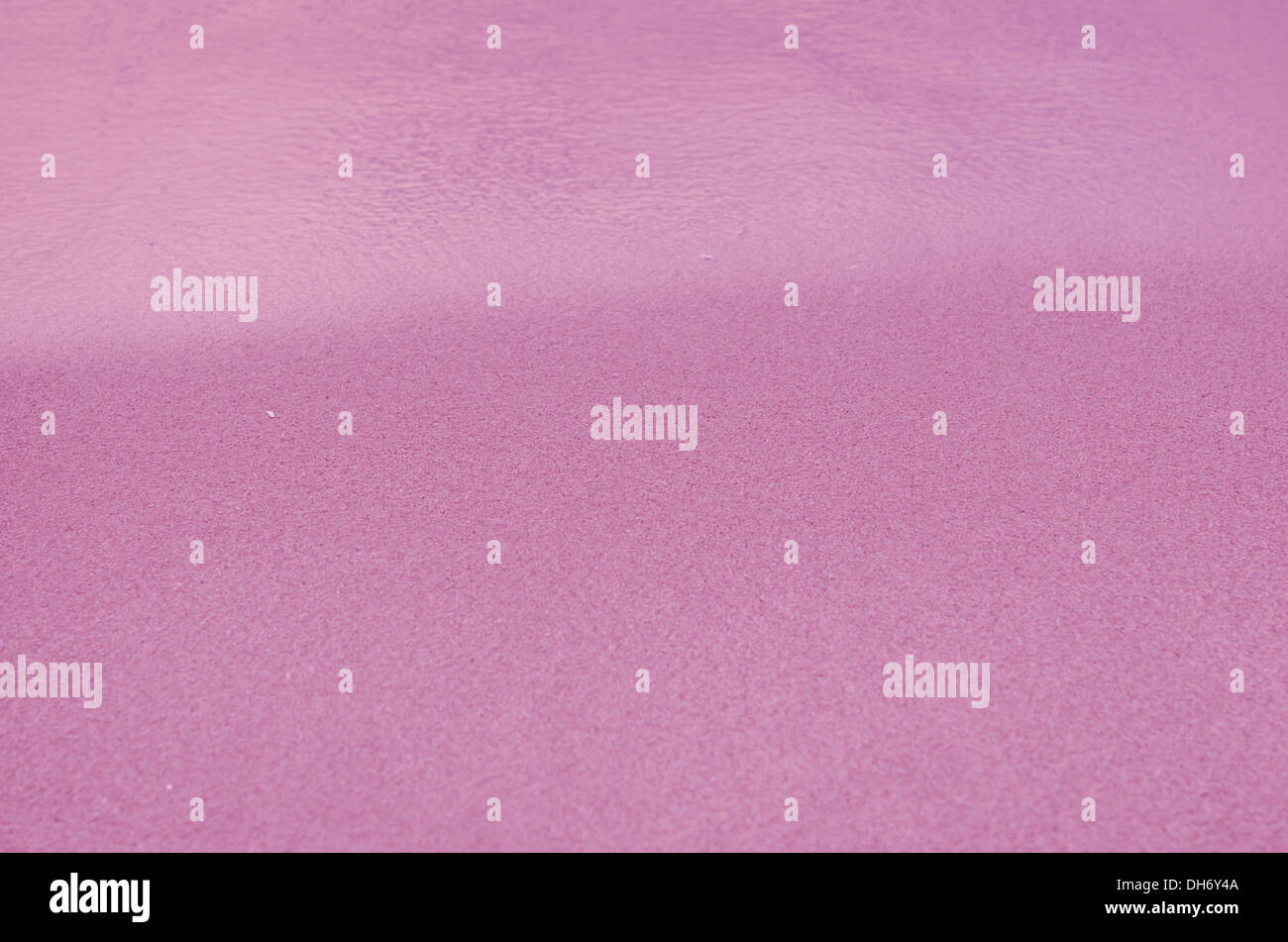 Pink Sandy beach background. Detailed sand texture and water . Top view ...