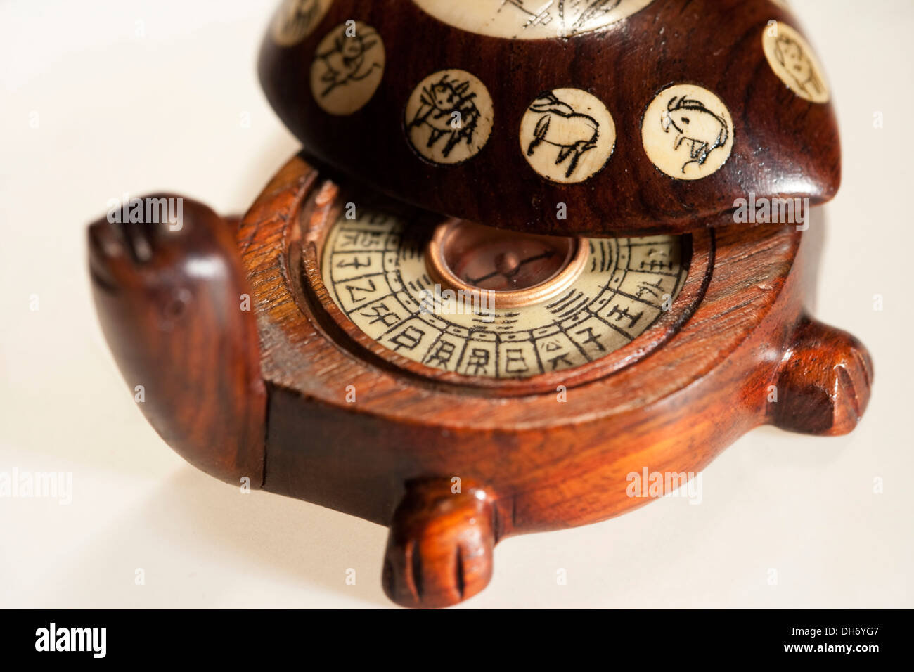 Compass inlaid in a wooden turtle Stock Photo - Alamy