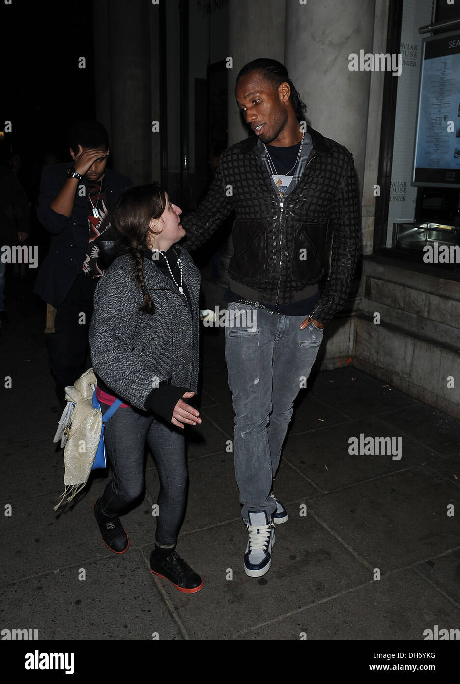 Chelsea FC footballer Didier Drogba, leaving Aura nightclub with other ...