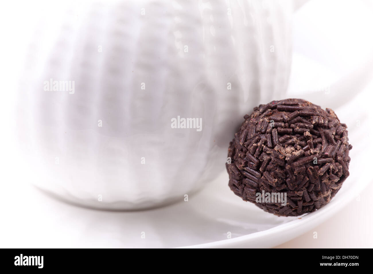 chocolate truffle on the plate near coffee cup Stock Photo - Alamy