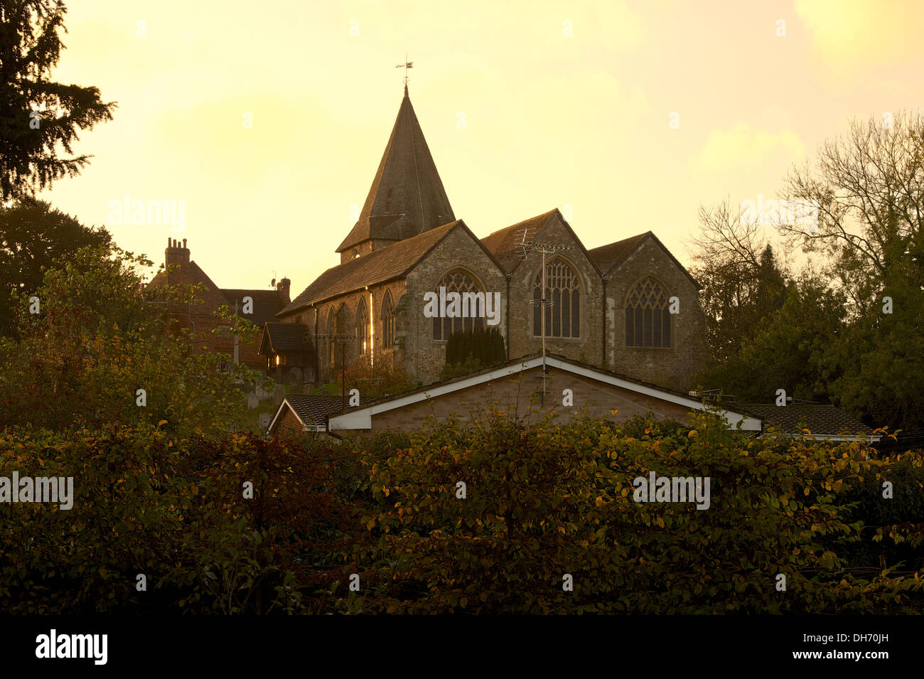 Church at twilight gold sky Stock Photo - Alamy