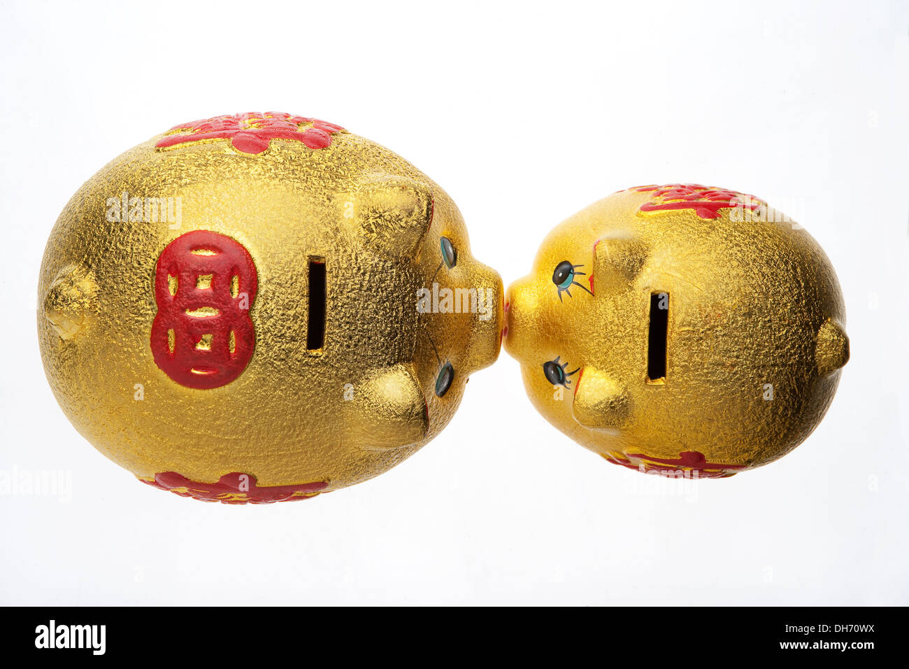 Two gold piggy banks Stock Photo - Alamy