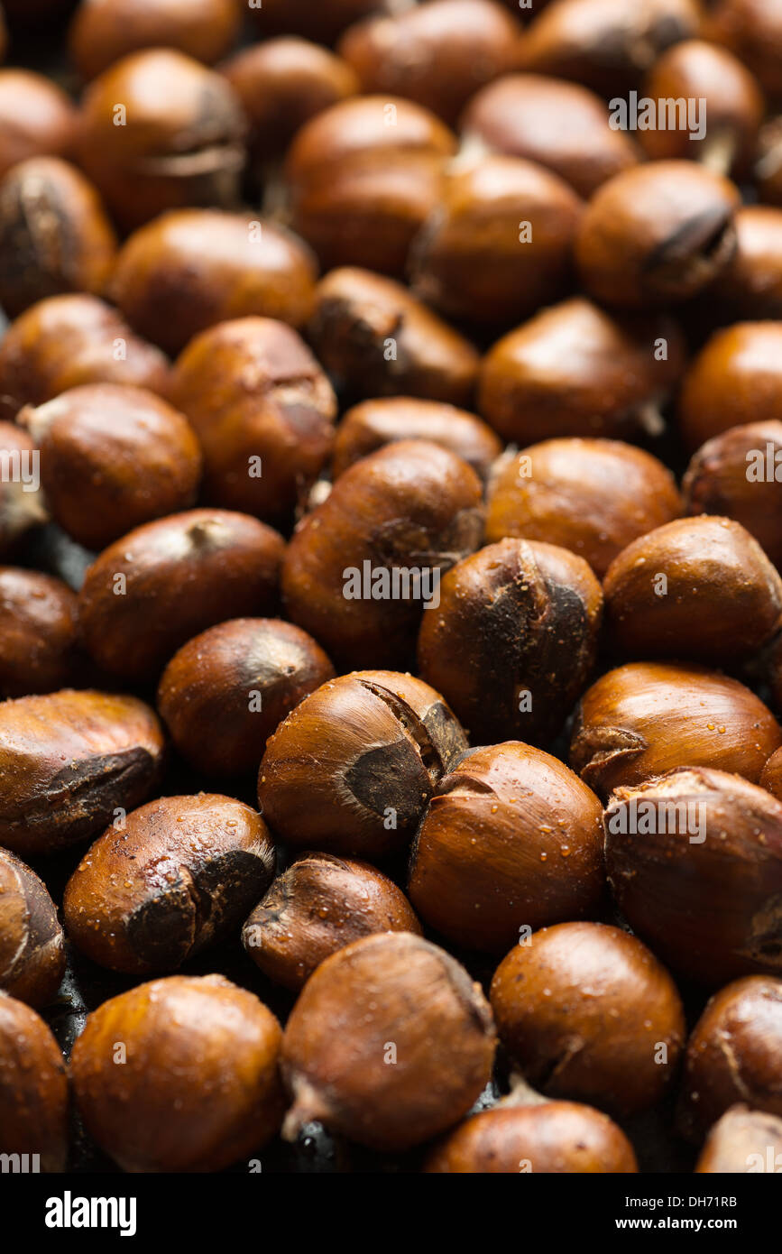 Sweet ripe roasted chestnuts fruit nuts from oven with shiny nut coats ...
