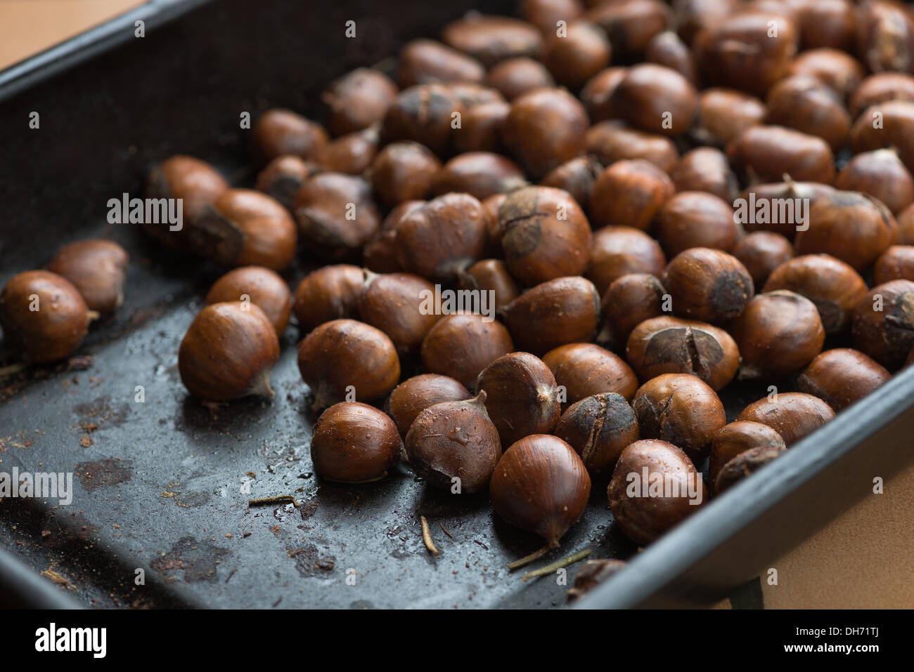 Sweet ripe roasted chestnuts fruit nuts from oven with shiny nut coats ...