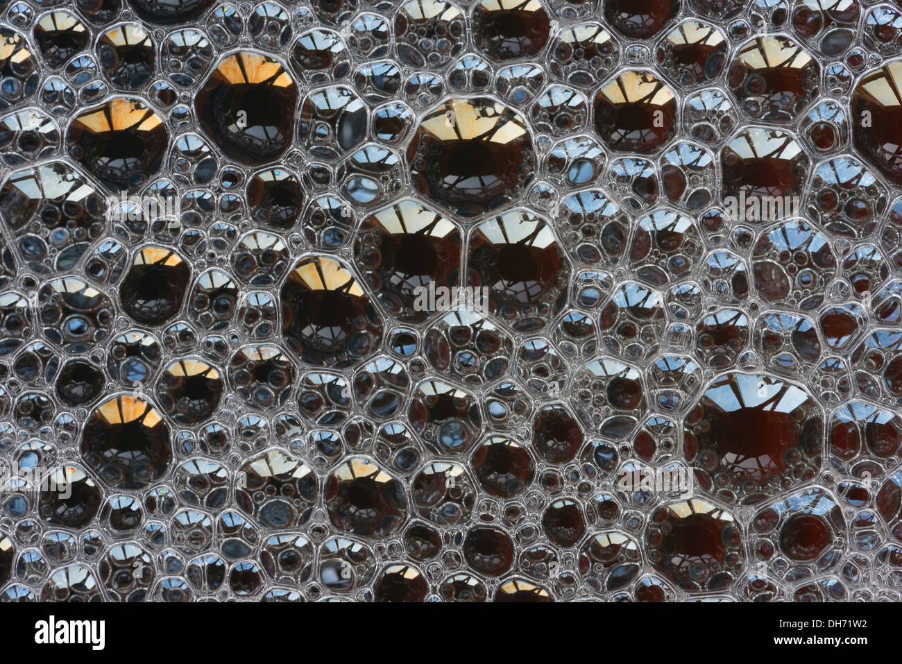 Bubbles with spectral colors being diffracted through thin surface film ...
