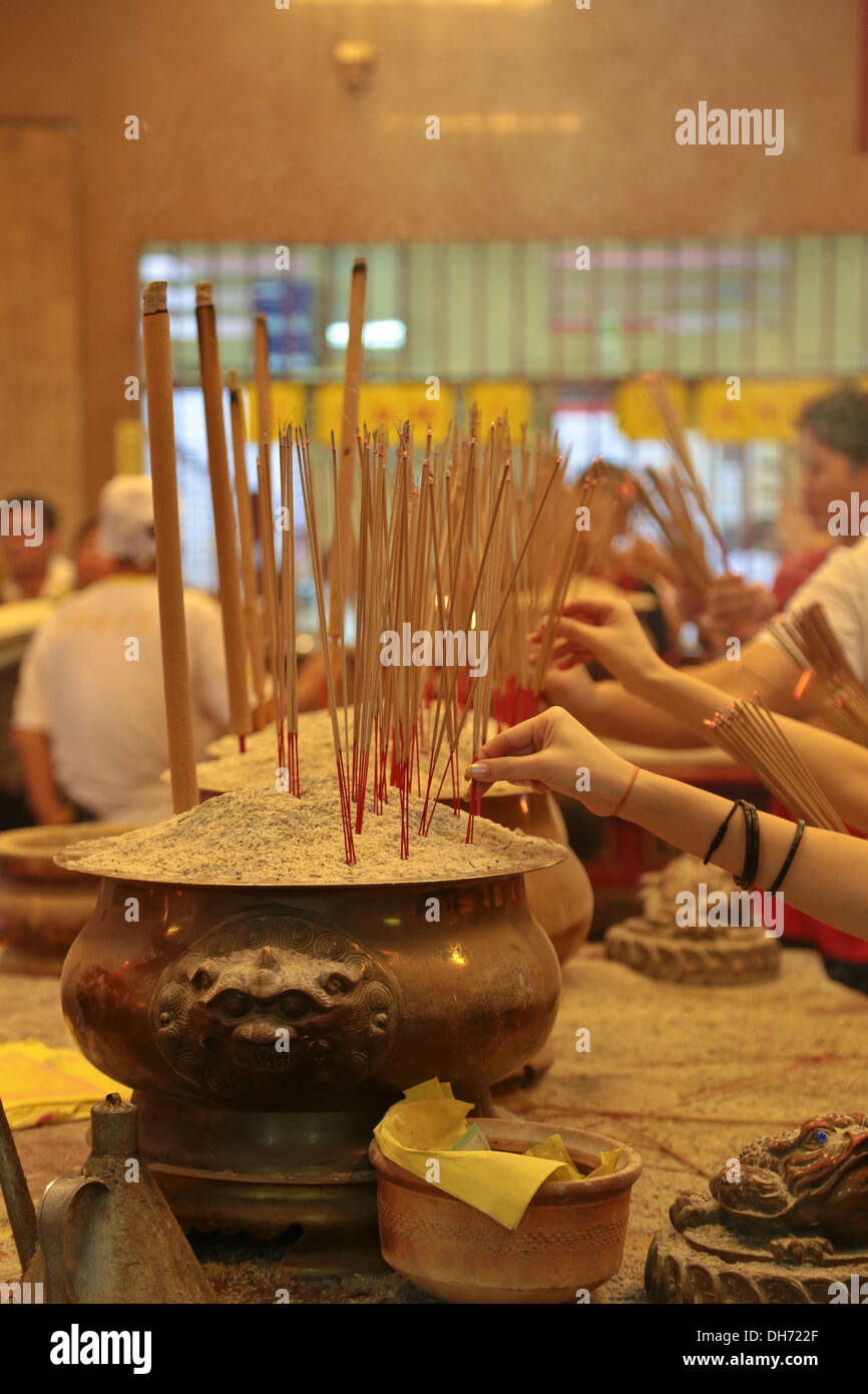 Buddhish devotees praying with joss stick during Nine Emperor Festival ...