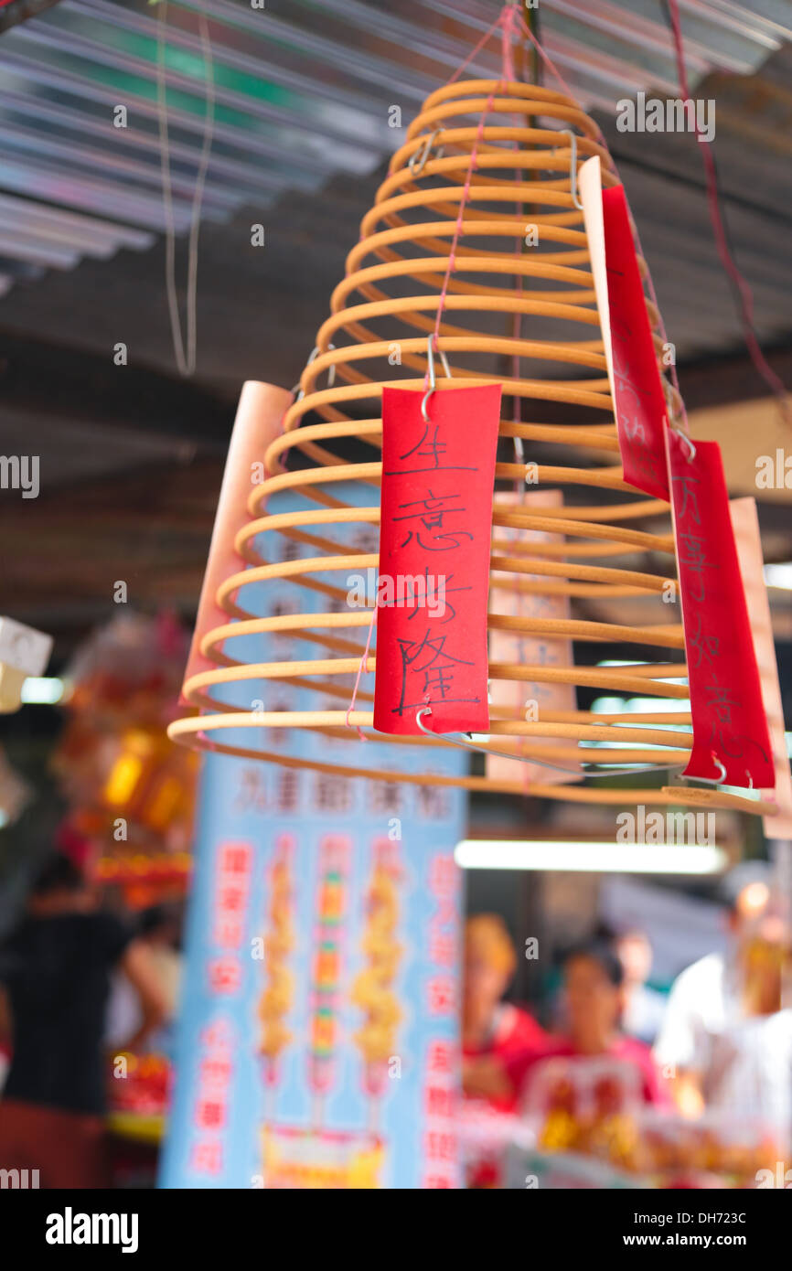 Joss stick coil with blessing word stickers Stock Photo - Alamy