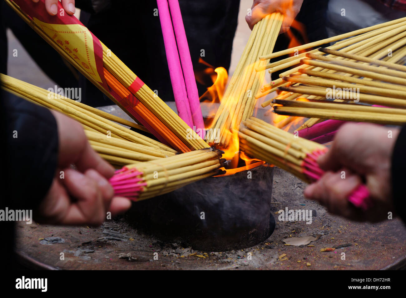 Incense being lit in temple hi-res stock photography and images - Alamy