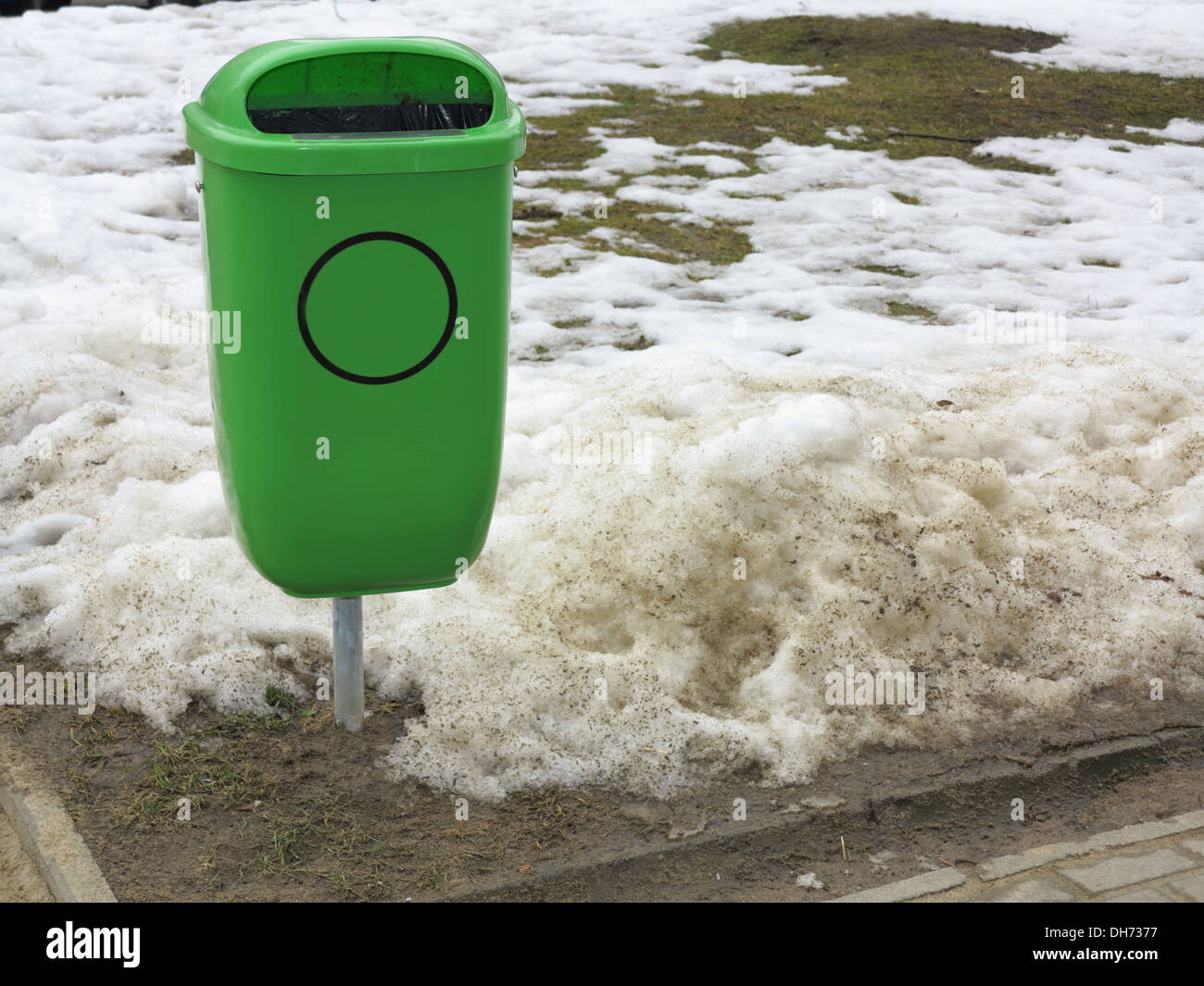 Green plastic garbage bin or can on street winter scenery Stock Photo ...