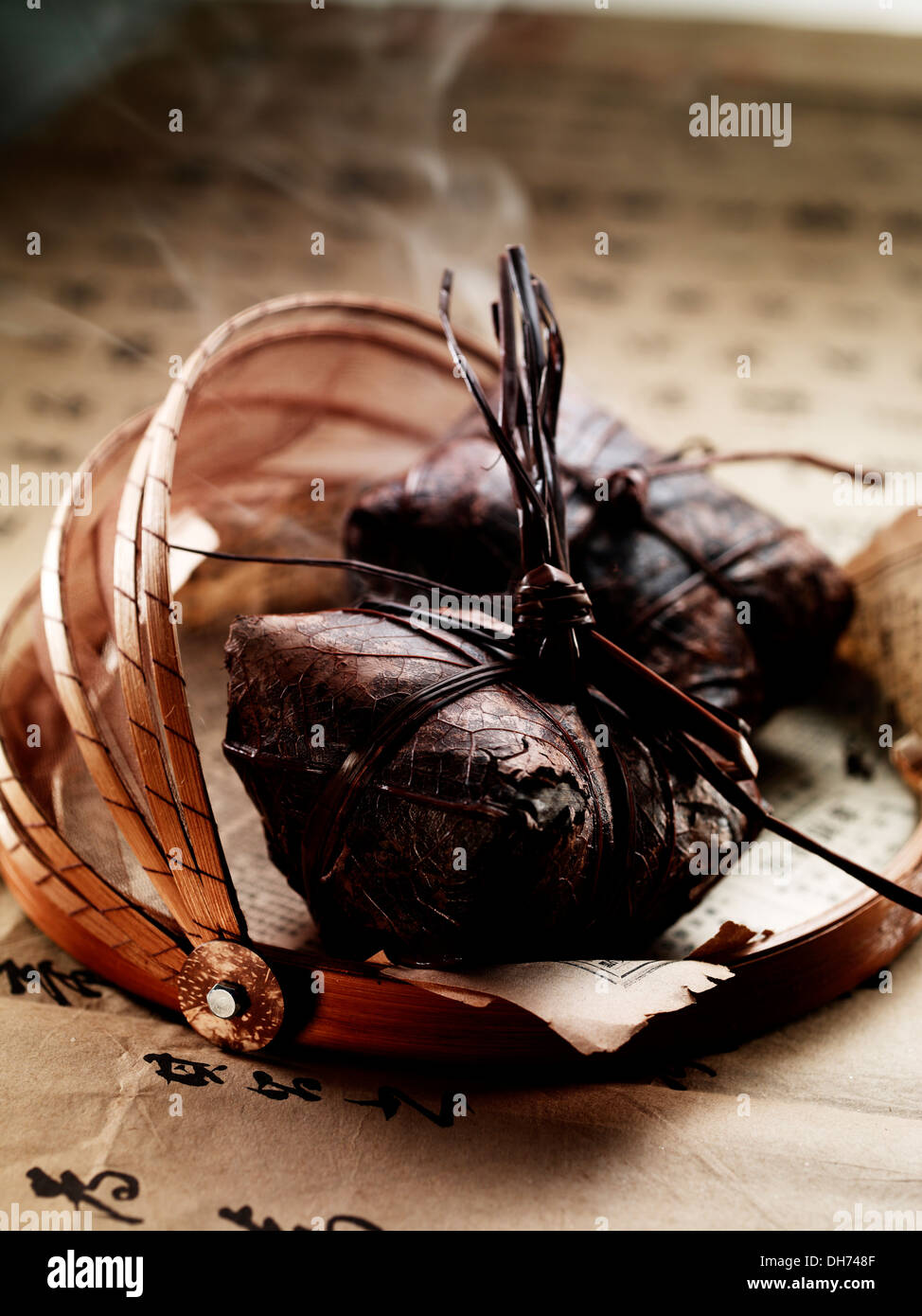 Chinese traditional food Zongzi in a bamboo container Stock Photo - Alamy
